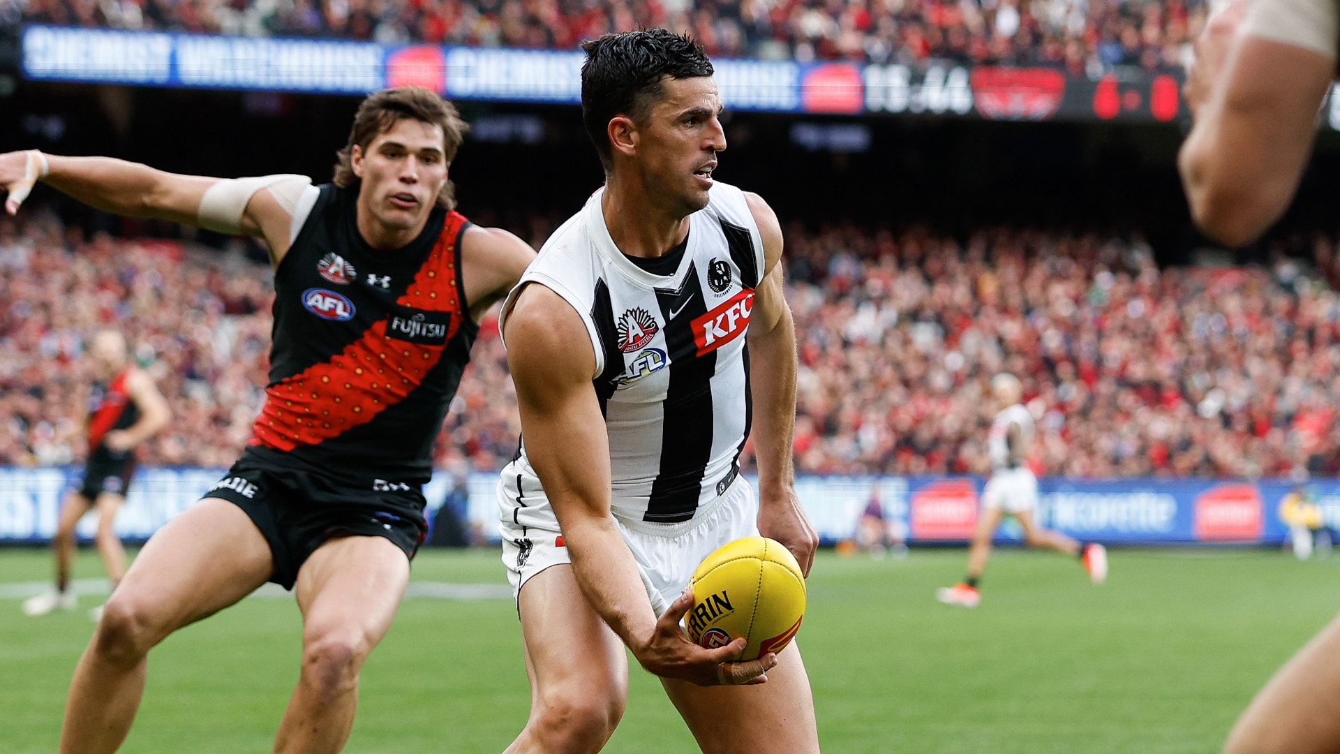 Ball magnet: Pies great makes history on Anzac Day stage