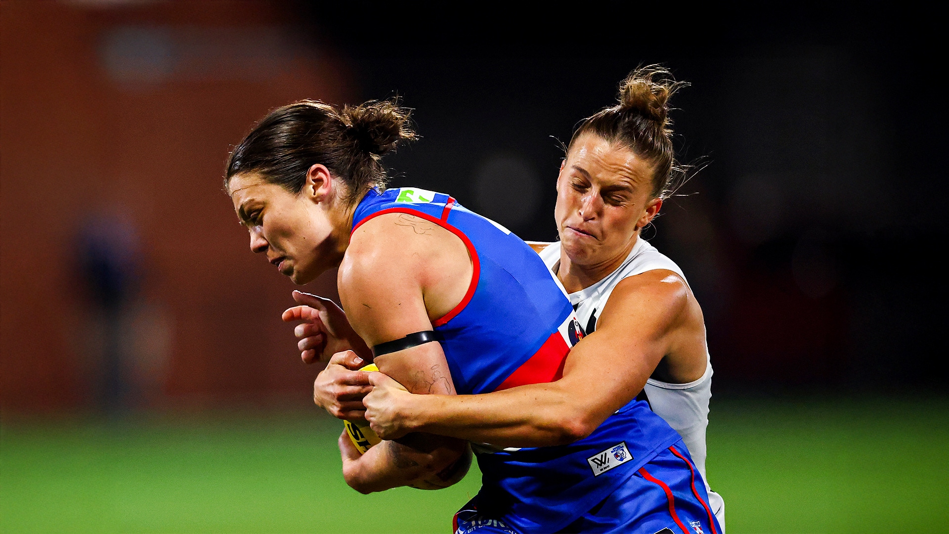 Pies go down in dog fight in Grand Final Eve clash